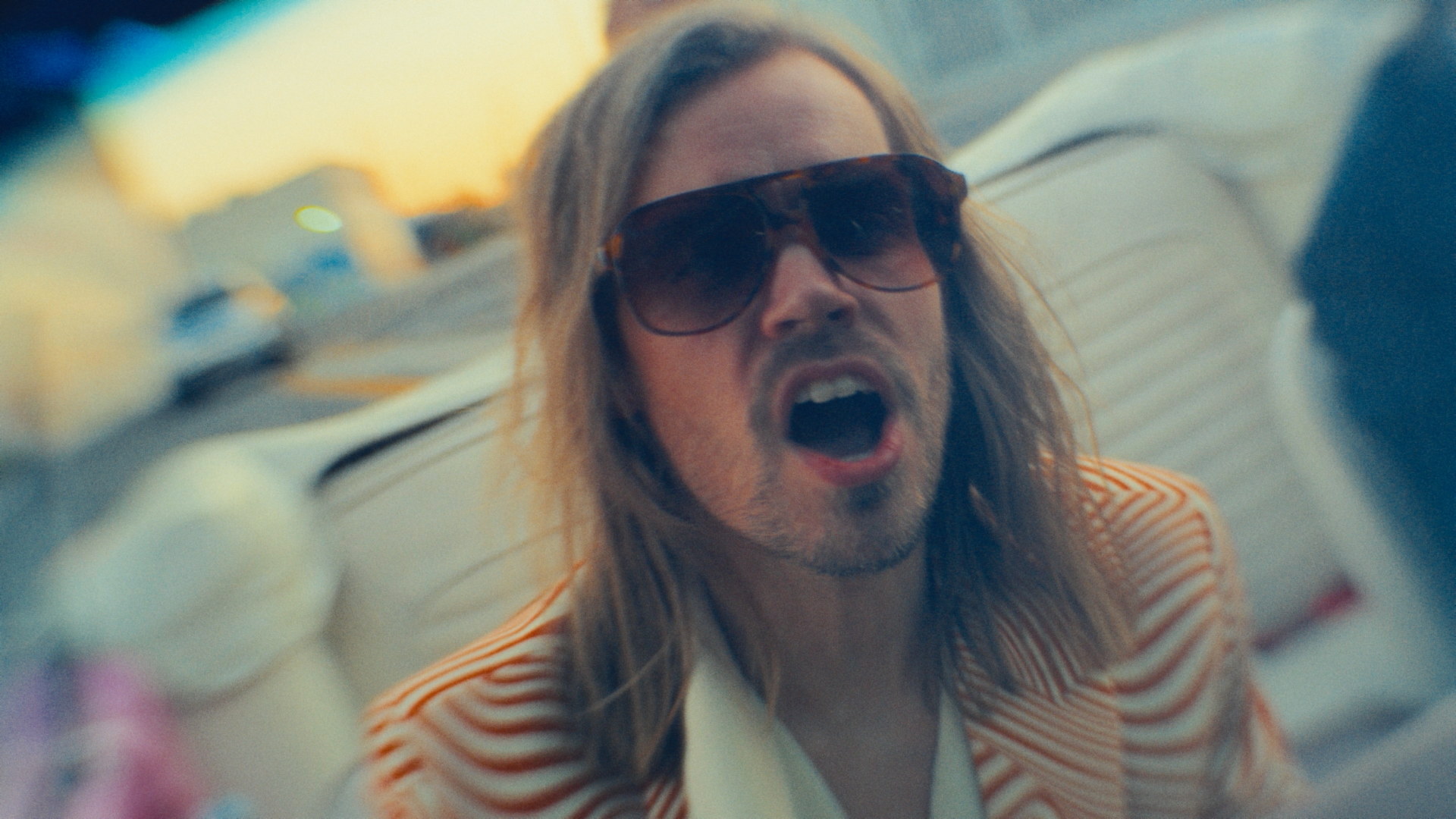 Screen grabs from the “Sad Times” music video by Grace & Moji. Color ...