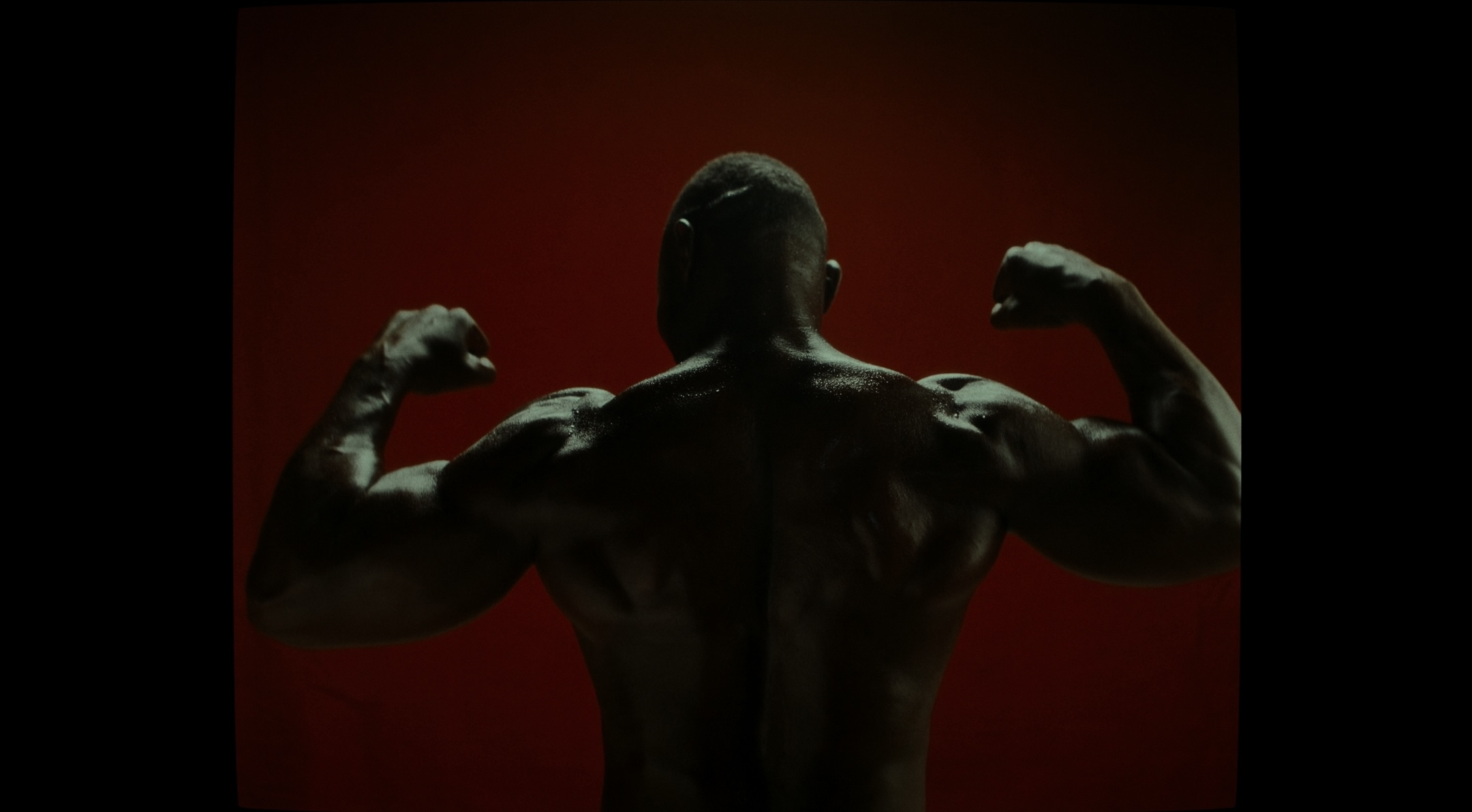 Screen grabs from the “FEFE NE FE” music video by Kwesi Arthur. Color ...